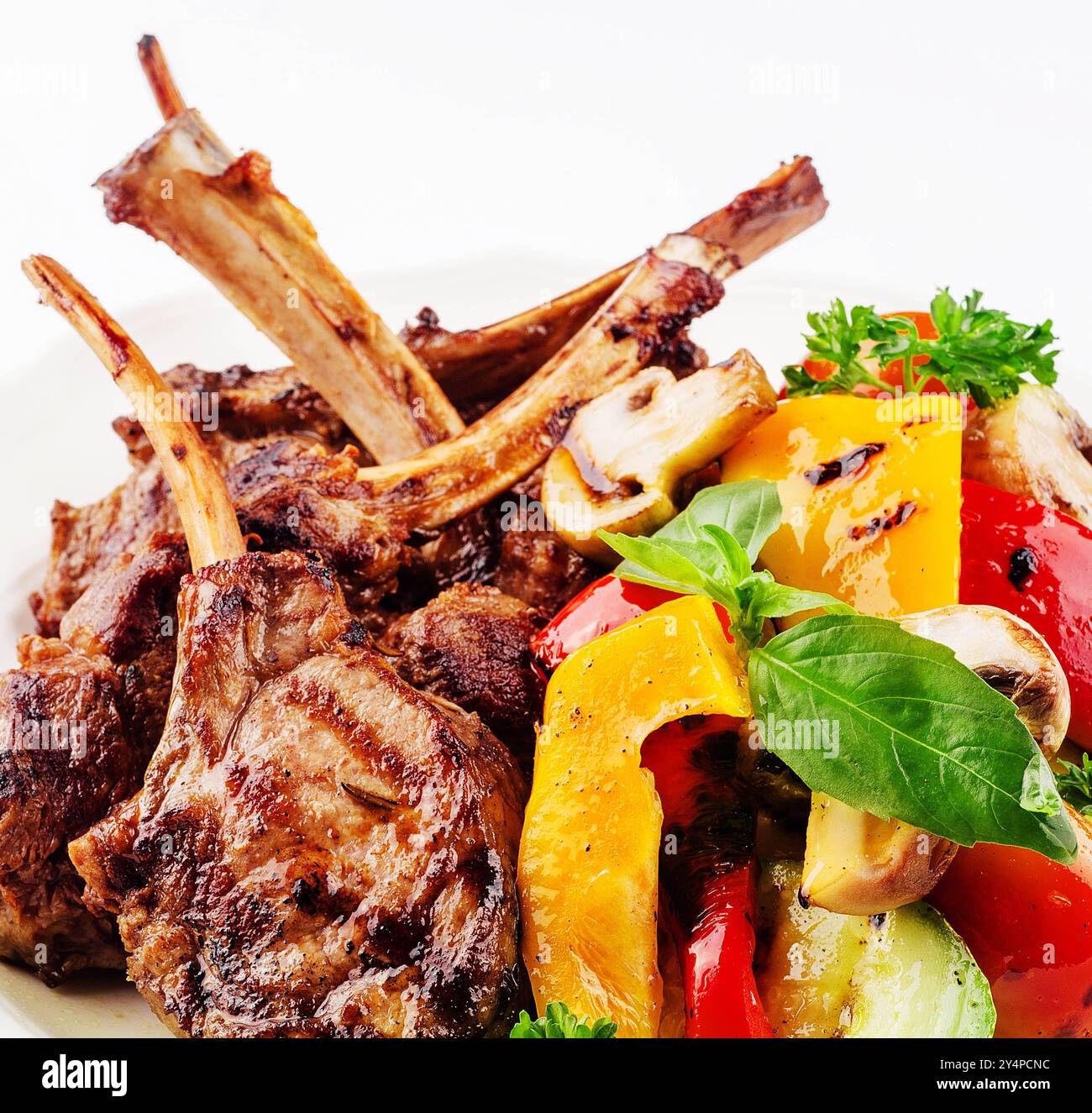 Grilled lamb rack with baked vegetables Stock Photo - Alamy