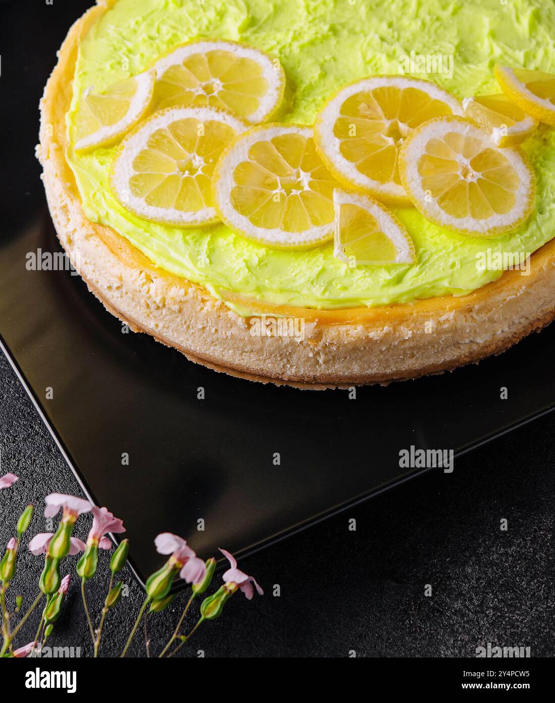 Layered Lemon Cheesecake on black plate Stock Photo - Alamy
