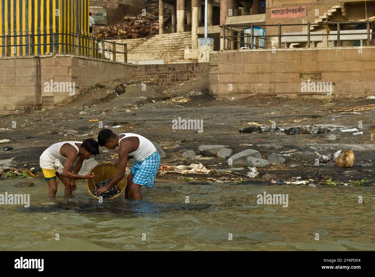 Monsoon rains and pilgrims and cremation rituals by the River Ganges ...