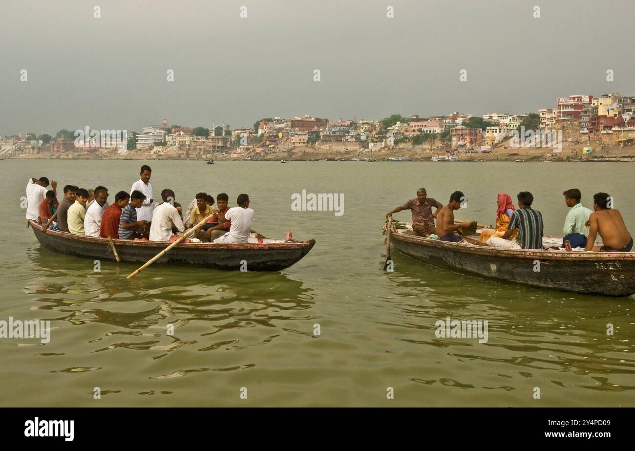 Monsoon rains and pilgrims and cremation rituals by the River Ganges ...