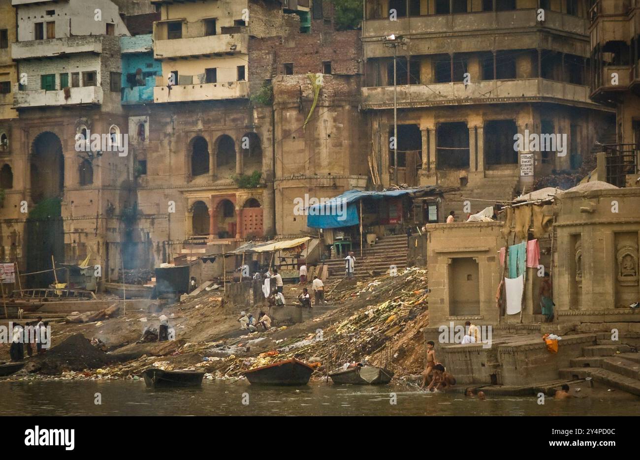 Monsoon rains and pilgrims and cremation rituals by the River Ganges ...