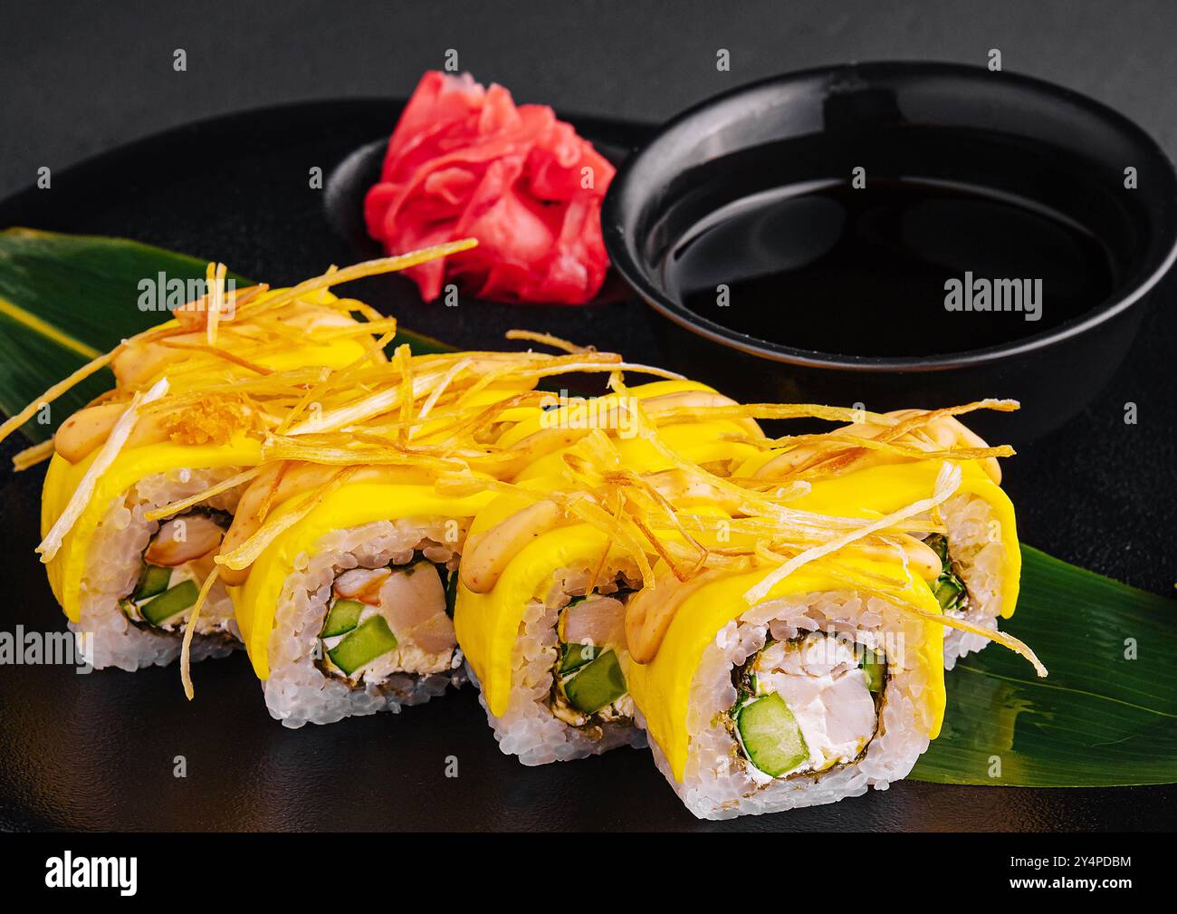 Yellow Sushi Rolls with shrimp and cucumbers Stock Photo - Alamy