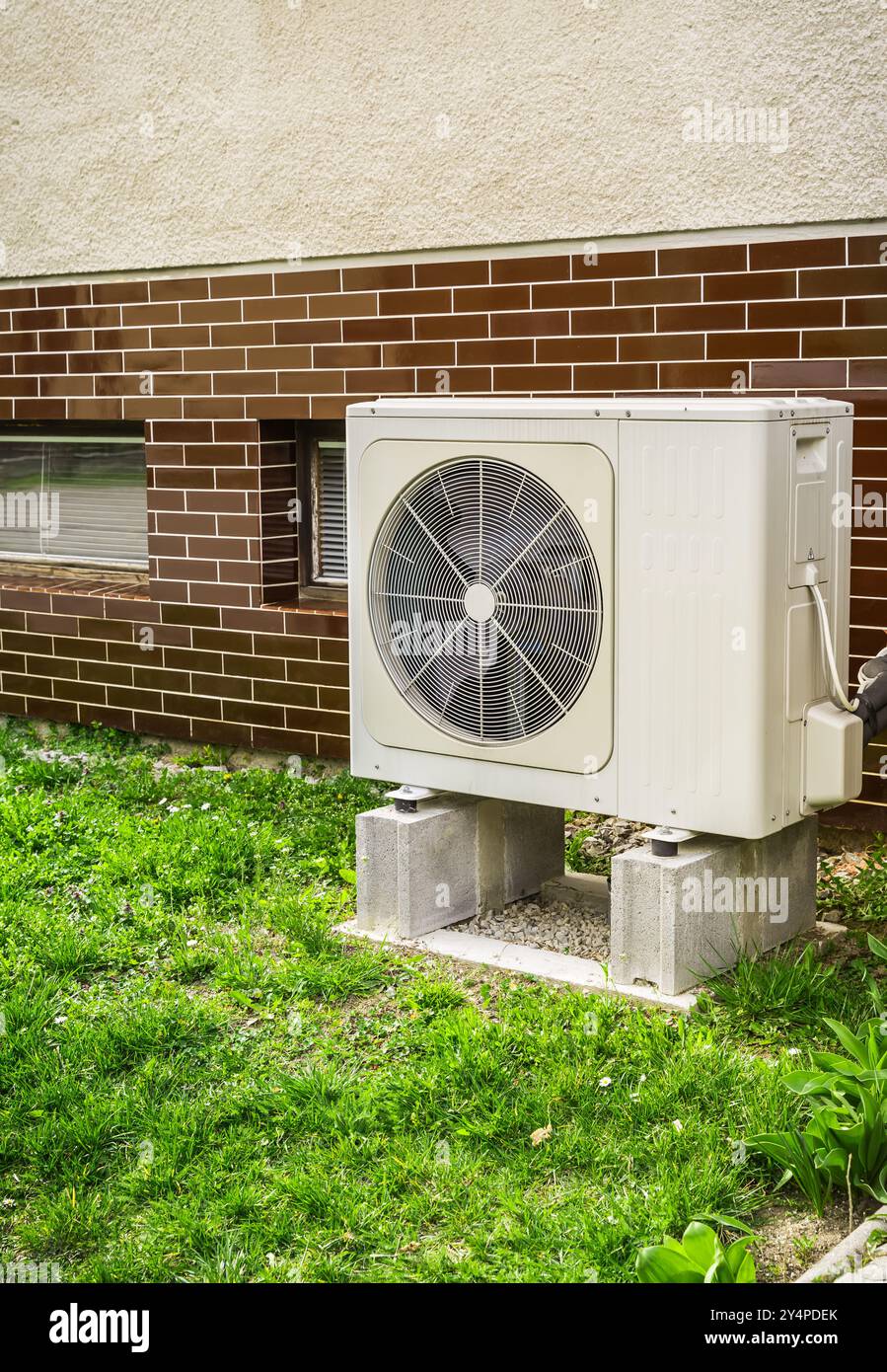 New air source heat pump installed outside of family house Stock Photo ...