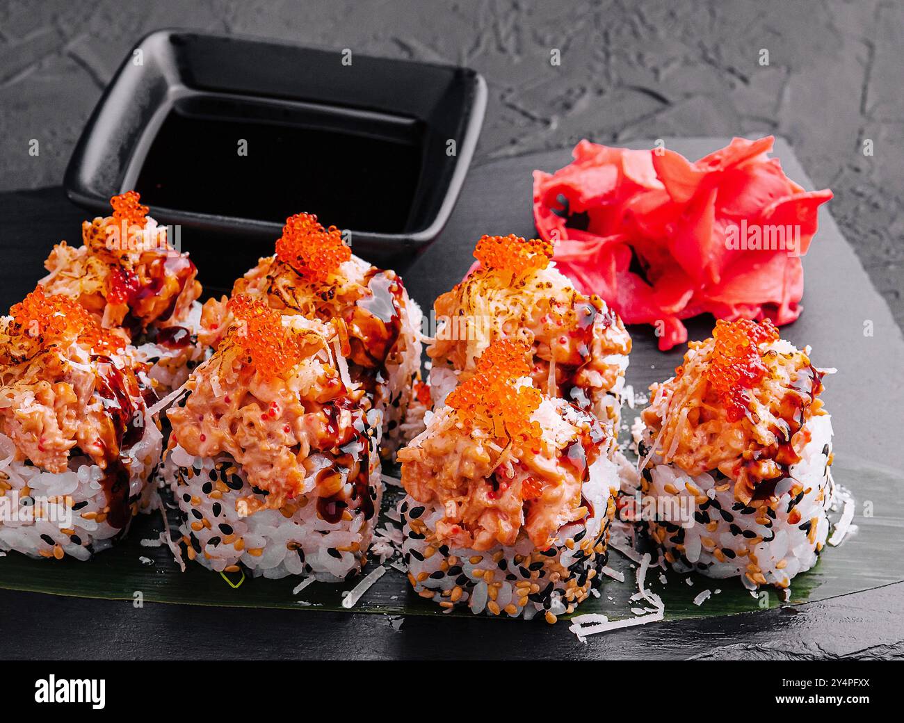 Japanese sushi volcano roll with eel on top and sesame inside Stock ...