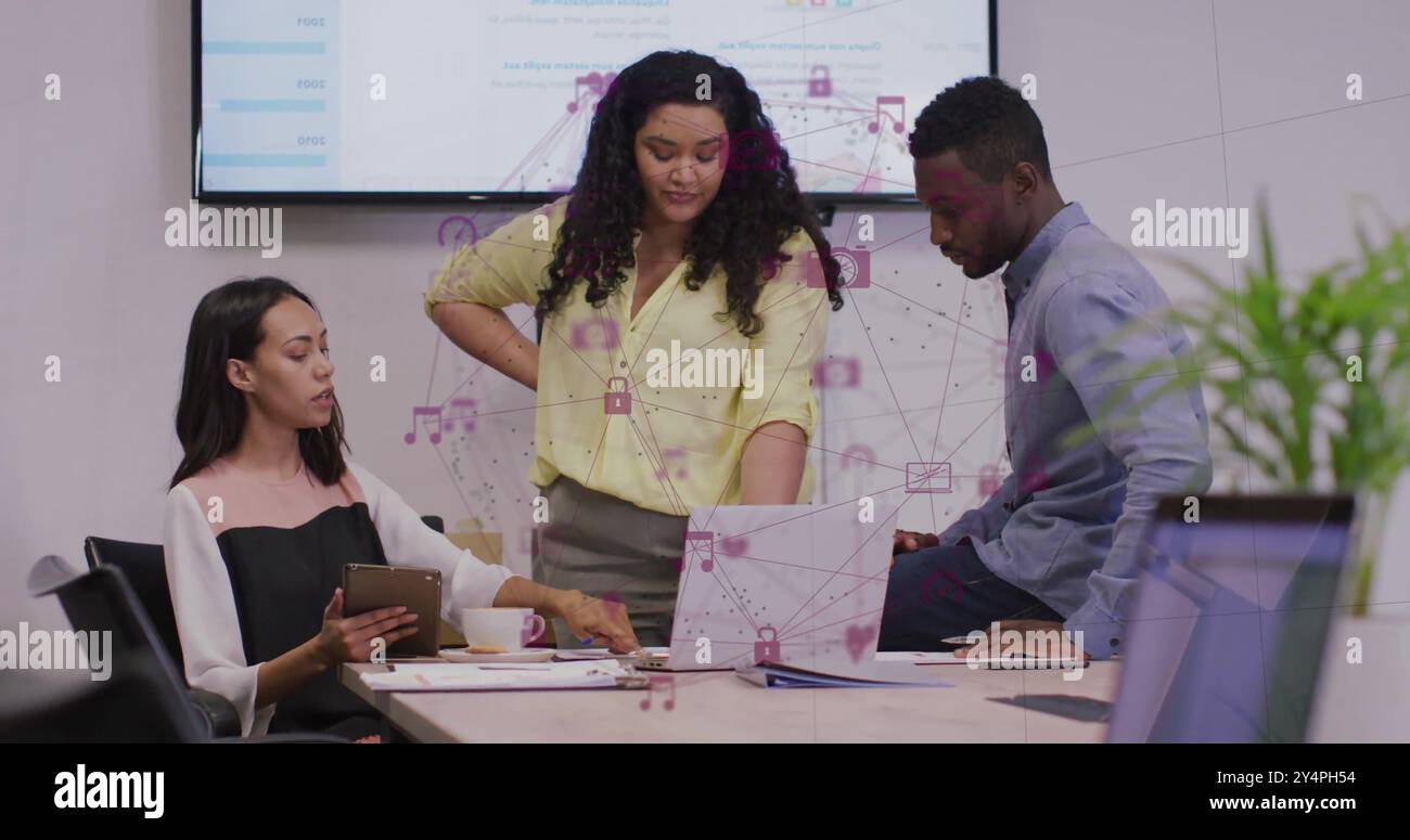 Image of network of connections with icons over diverse business people ...