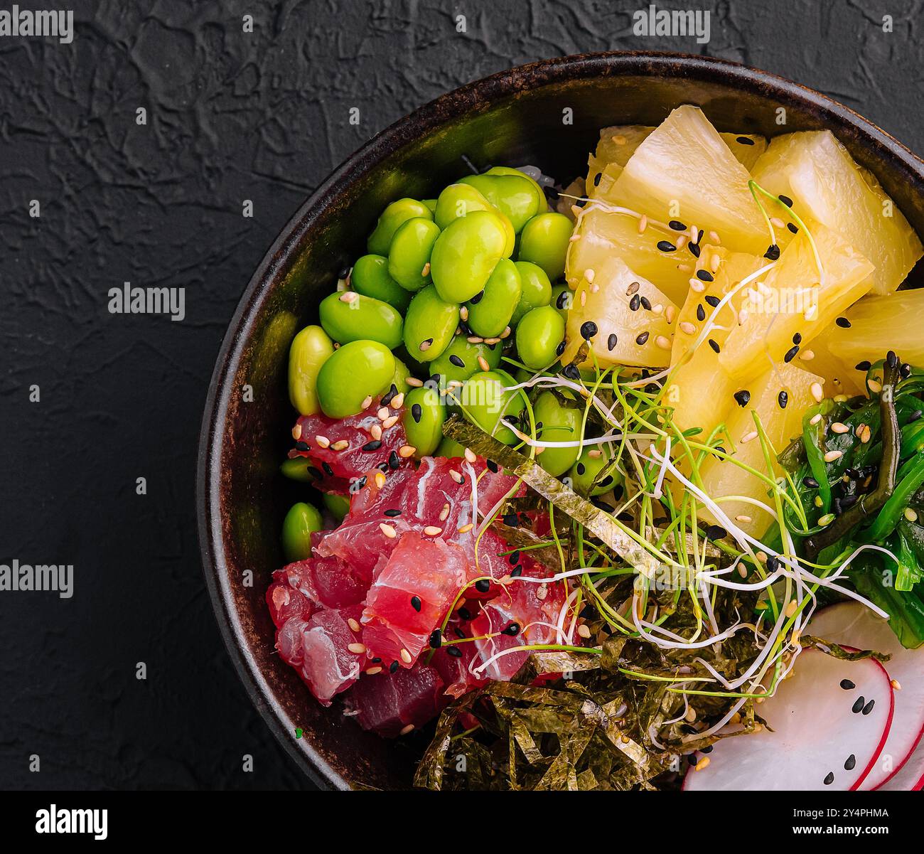 Hawaiian tuna poke salad in the bowl top view Stock Photo - Alamy