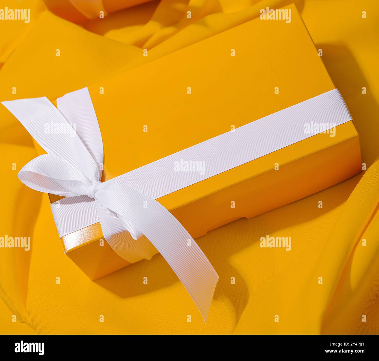 Yellow gifts on a yellow background Stock Photo - Alamy