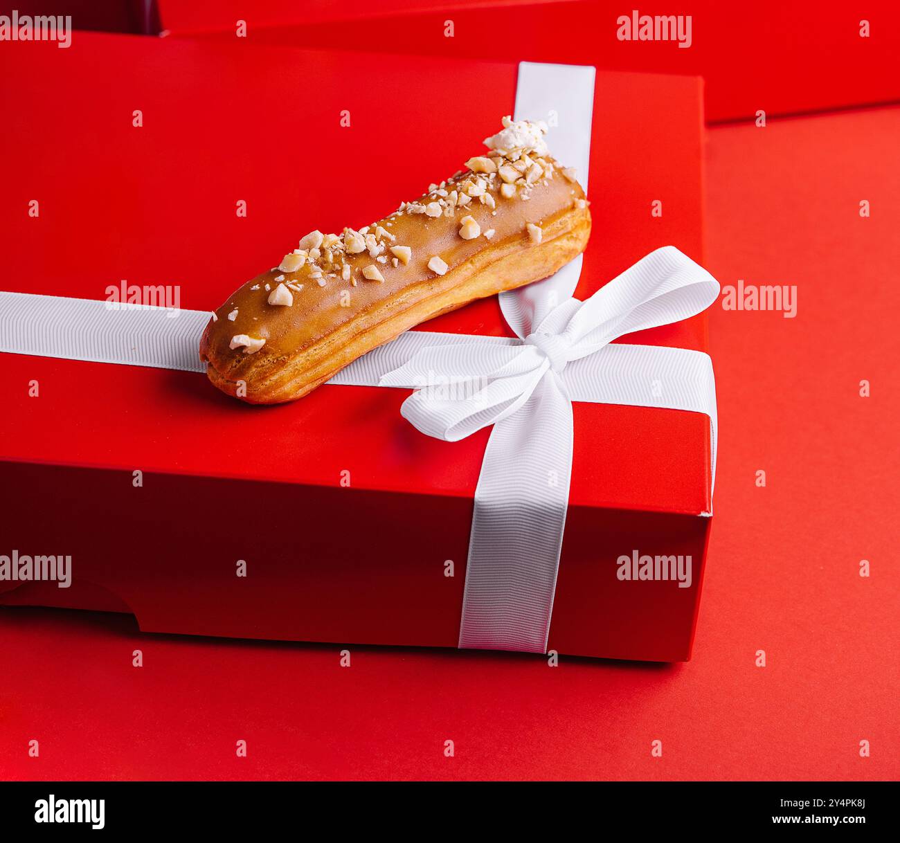 Christmas gifts presents with French eclair Stock Photo - Alamy