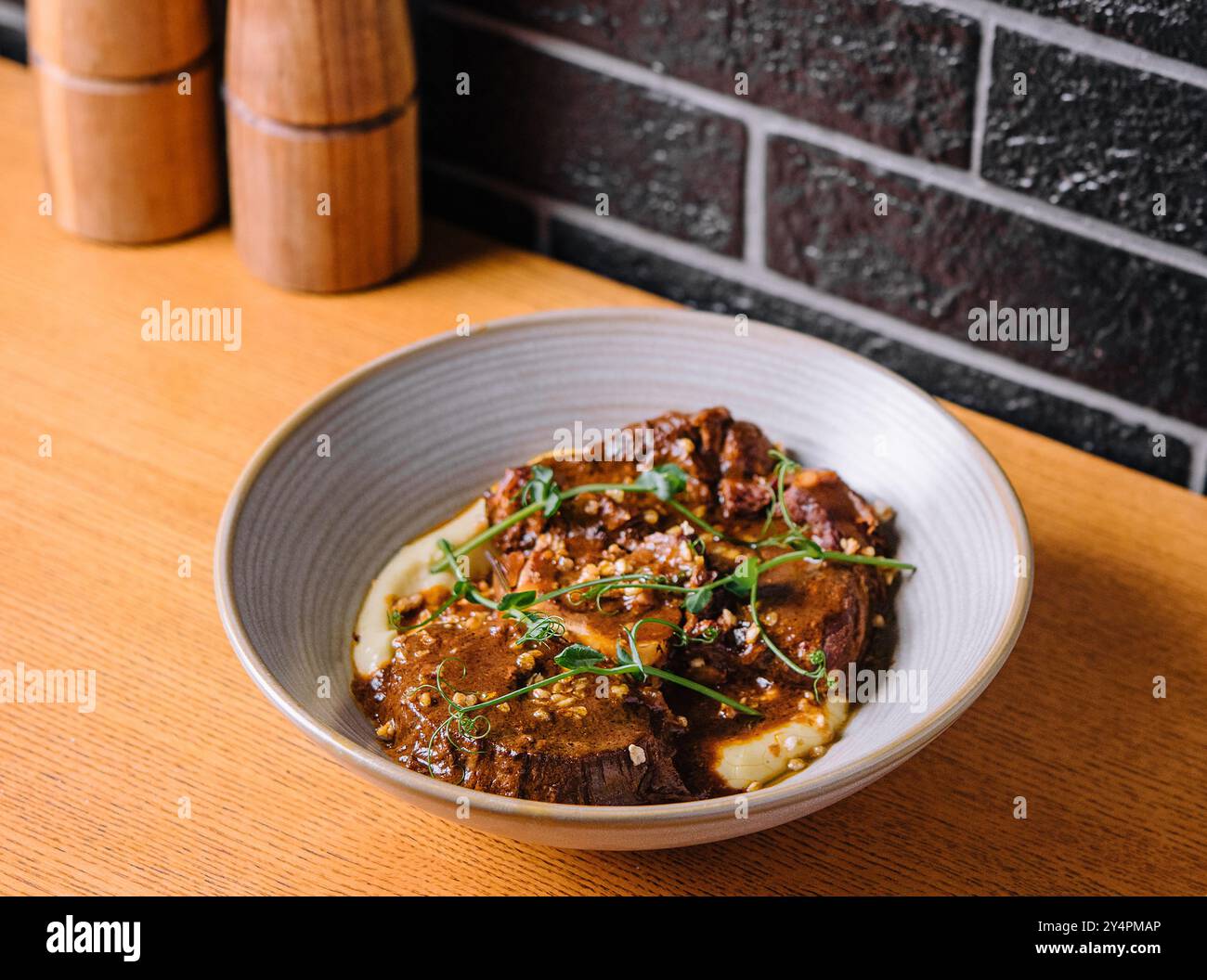 Traditional german braised veal cheeks in brown sauce with mashed ...