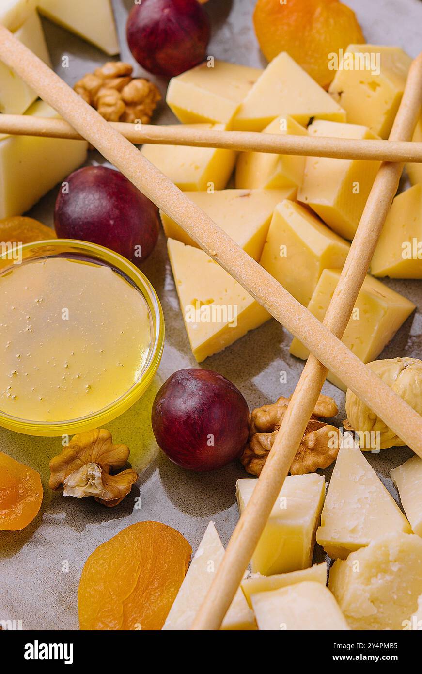 Cheese platter with organic cheeses, fruits, nuts and wine Stock Photo ...