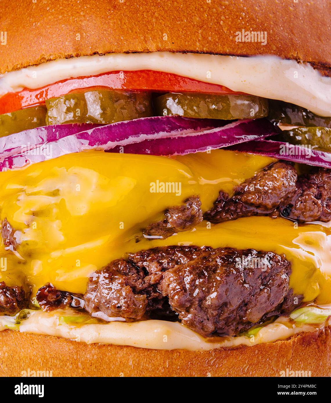 Large cheeseburger with two beef patties grilled Stock Photo - Alamy