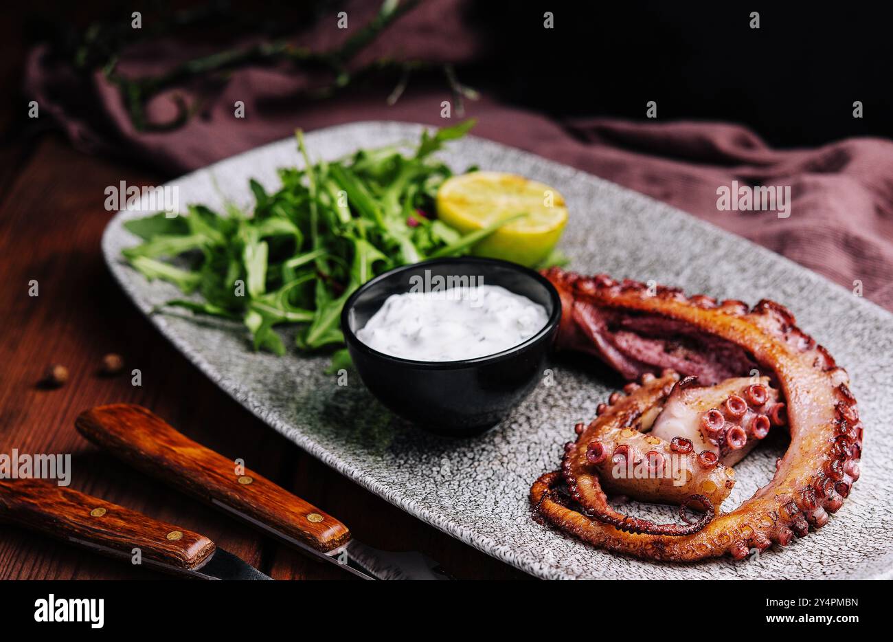 Traditional french octopus braised cooked with salicornia, lemon curd ...