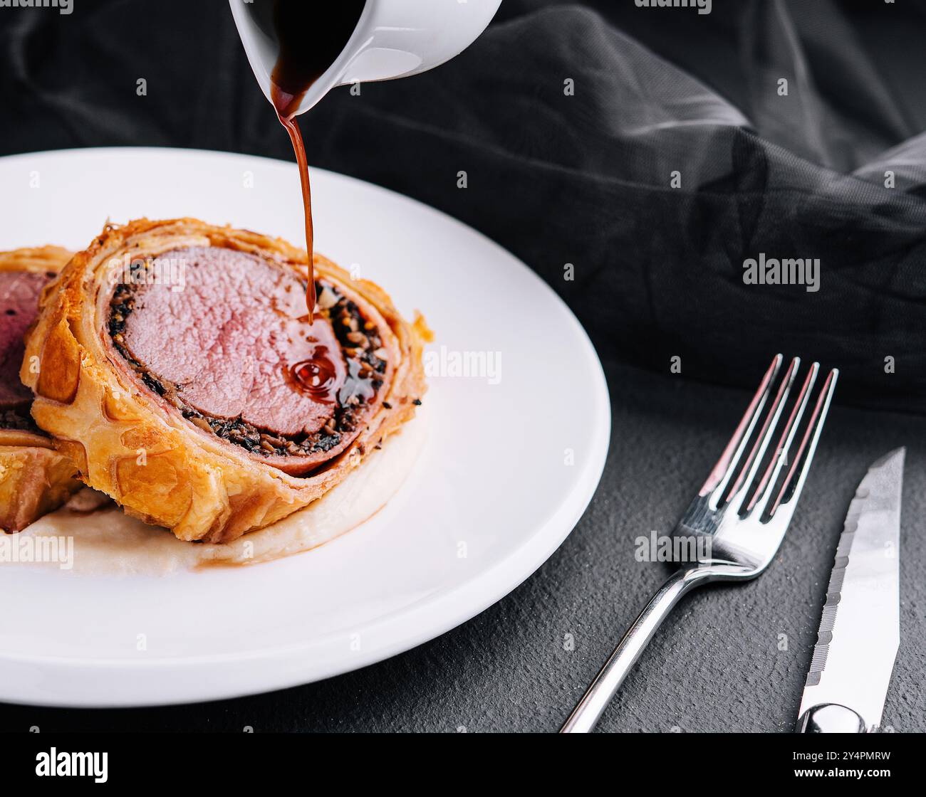 Fillet wellington in puff pastry on plate Stock Photo - Alamy