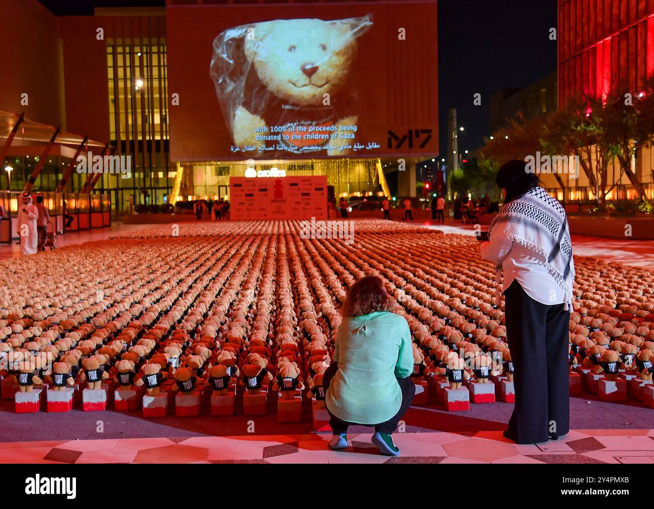 People visit the installation of teddy bears titled ''Echo of Lost ...
