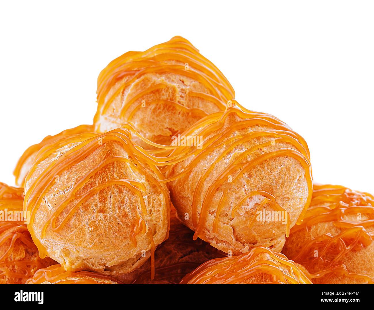 Tasty round eclairs with cream on white background Stock Photo - Alamy