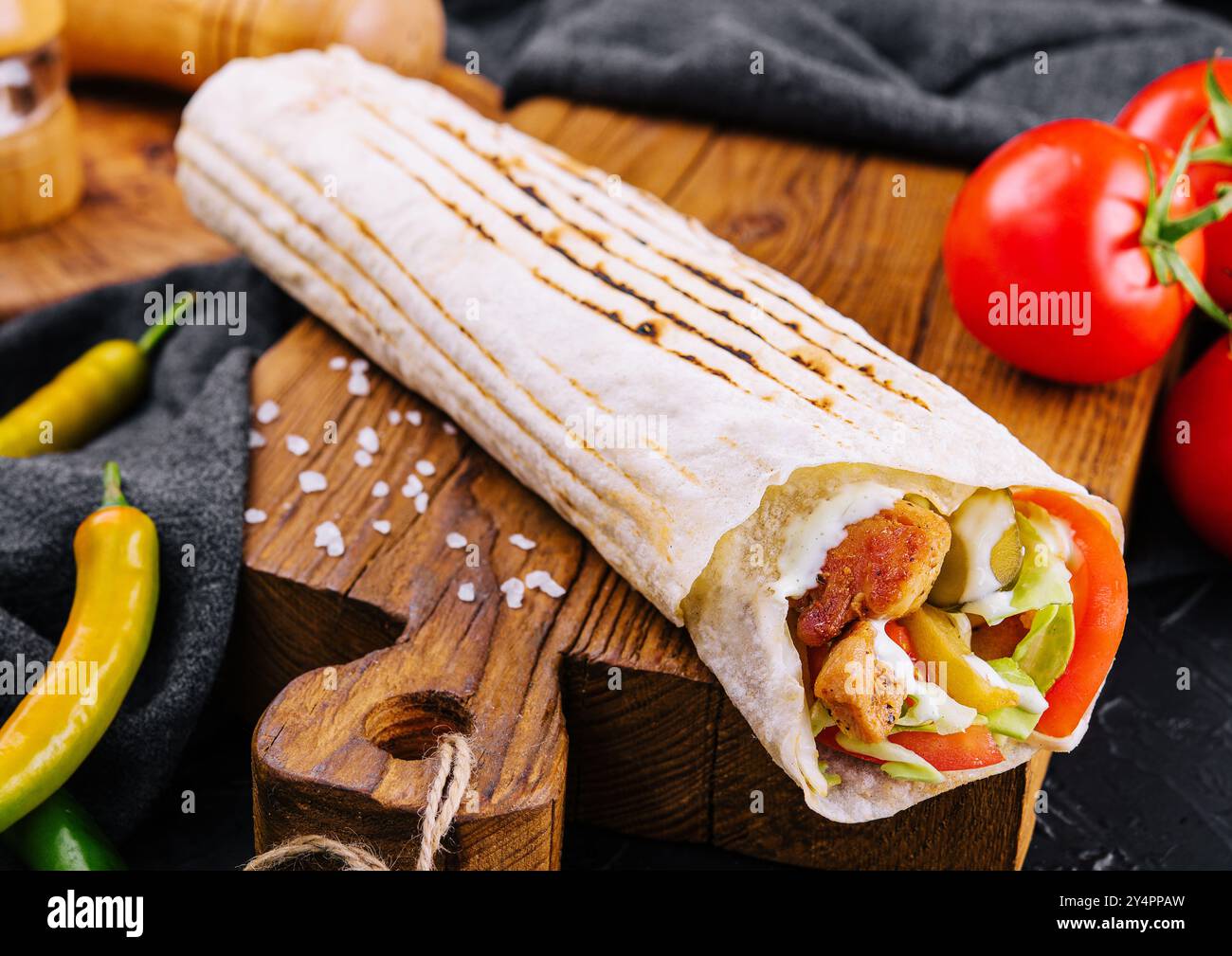 Shawarma rolled in lavash, moist grilled meat Stock Photo - Alamy