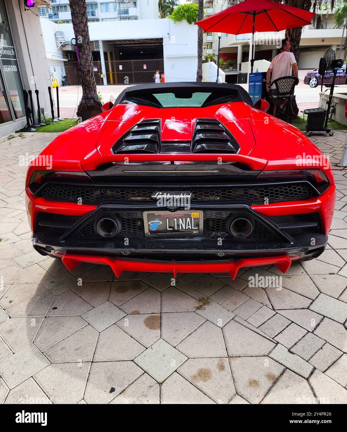 Miami Beach, Florida USA - June 8, 2024: Lamborghini Huracan red at Miami beach. Lamborghini is ...