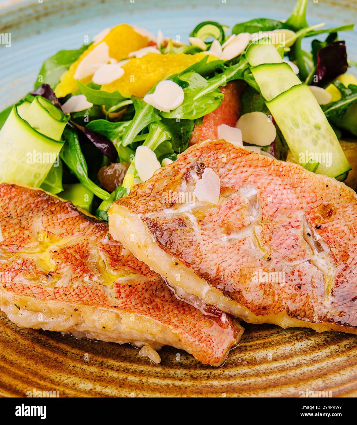 Grilled Red Snapper fish fillets and fresh vegetable salad Stock Photo ...