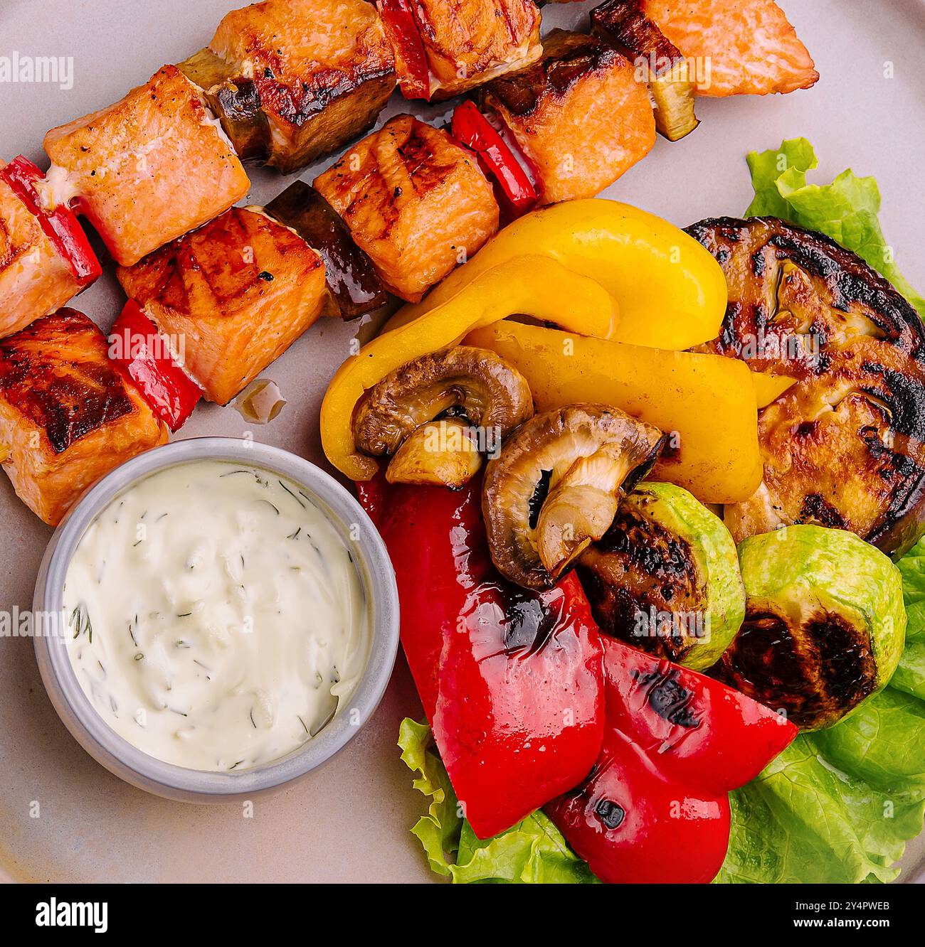 Grilled salmon fish kebab skewers with grilled vegetables Stock Photo ...