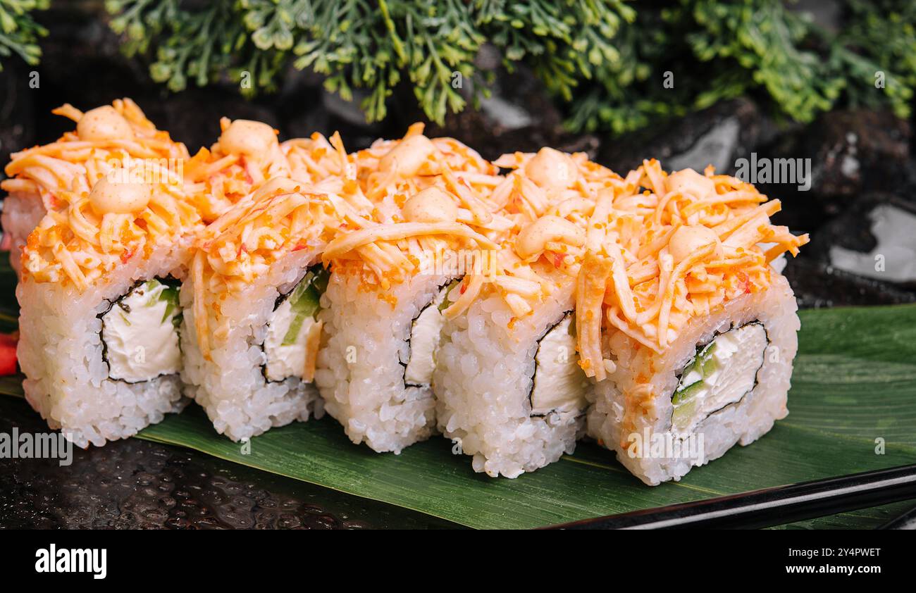 cheese ebi sushi rolls with sauce Stock Photo - Alamy