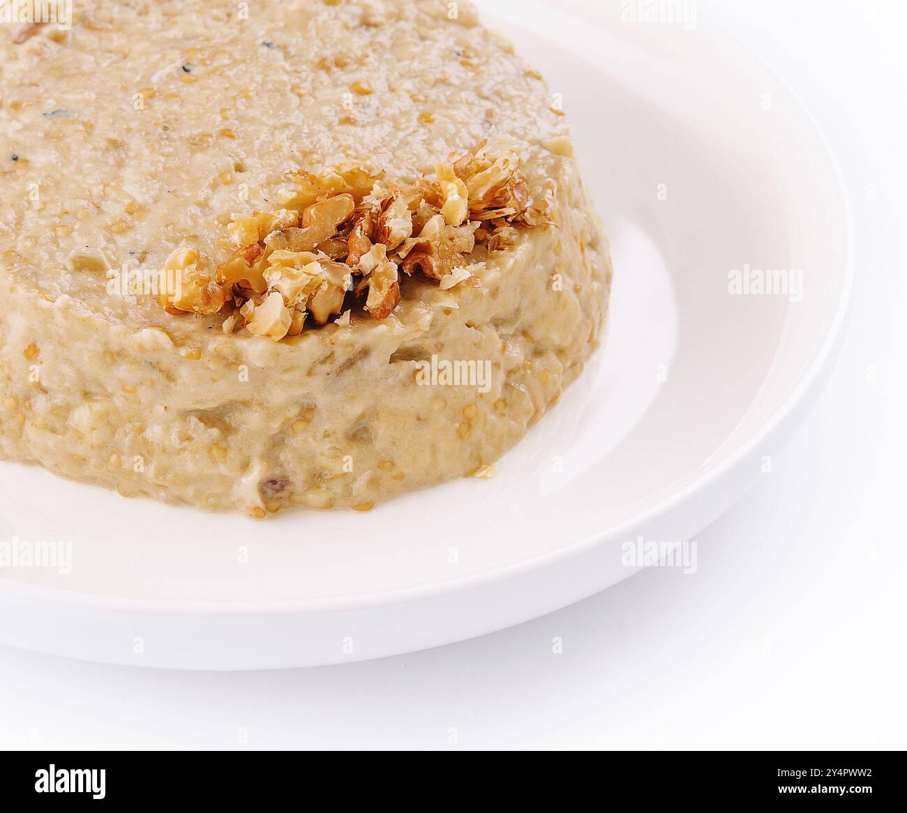 Oatmeal porrige in white plate isolated Stock Photo - Alamy