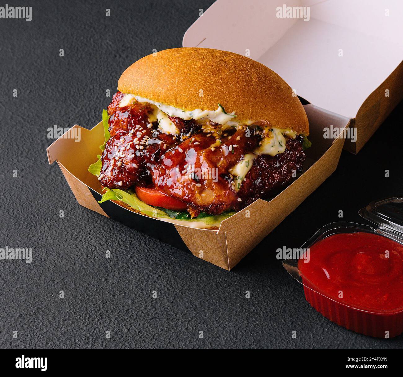 burger with spicy asian style glazed chicken Stock Photo - Alamy