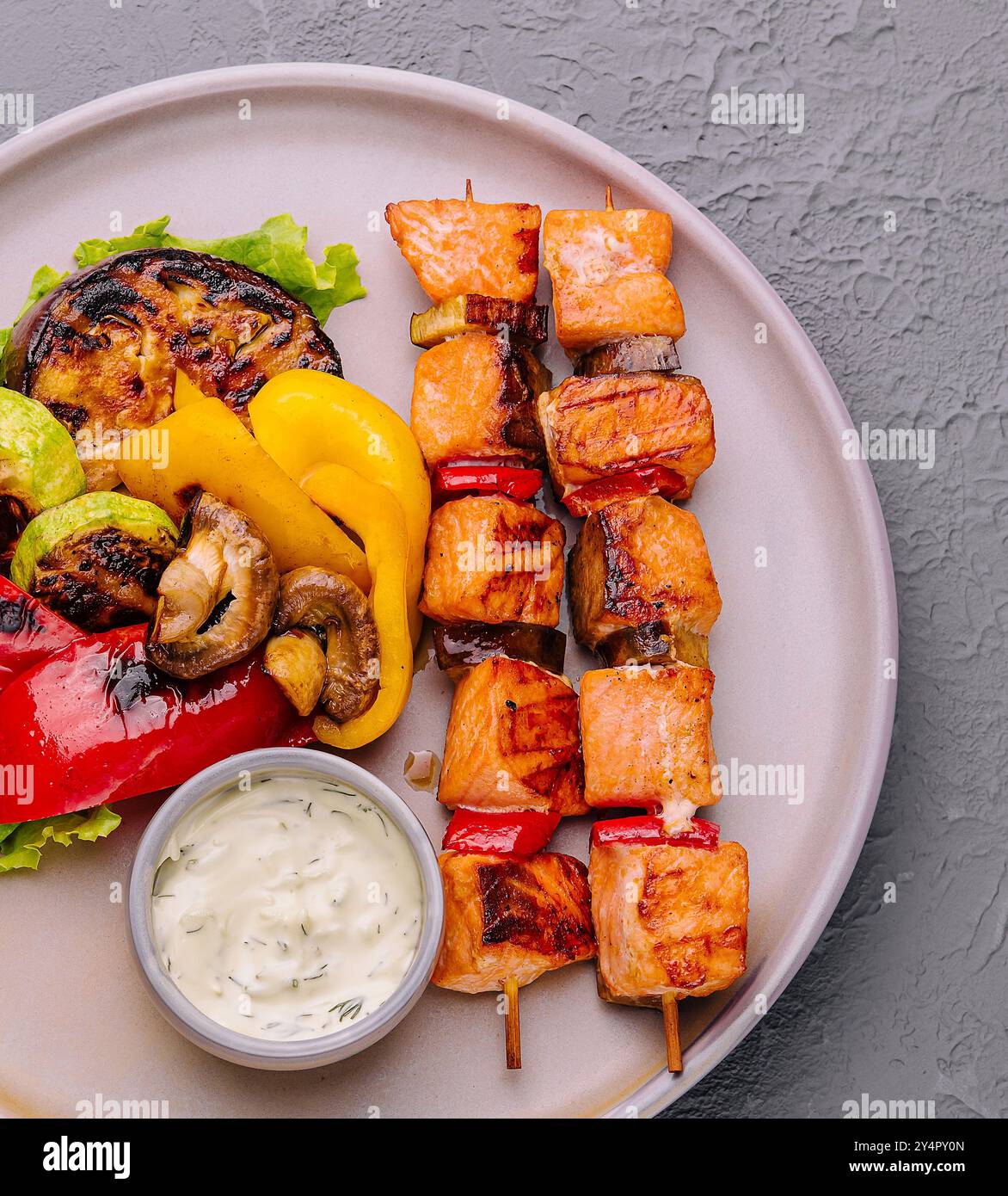 Grilled salmon fish kebab skewers with grilled vegetables Stock Photo ...