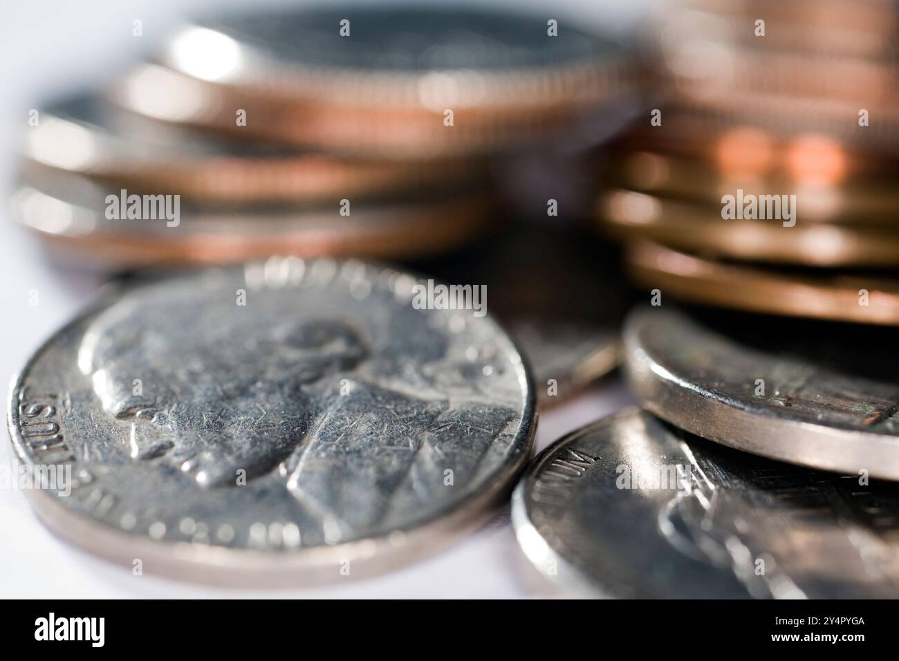 A close-up view of various US coins including a nickel featuring ...