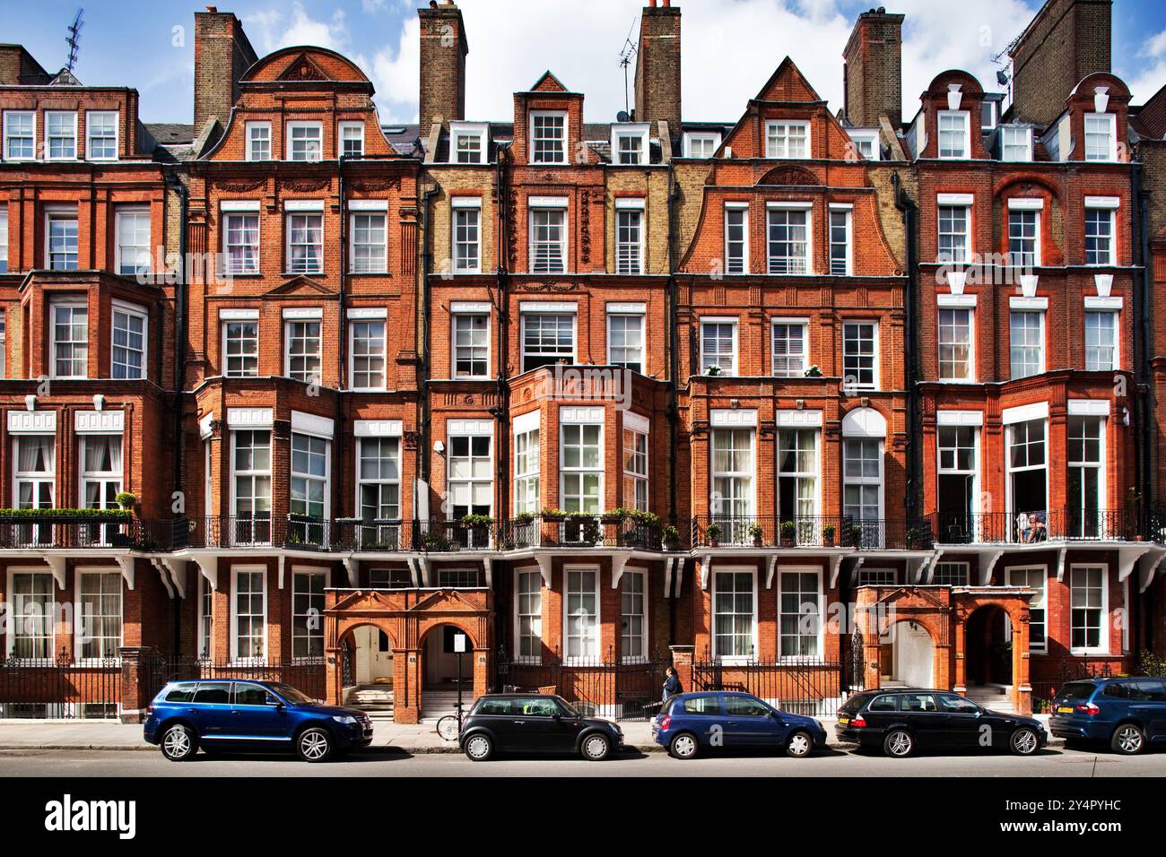 London, UK, May 2 2009, Colorful Victorian houses in red brick stand ...