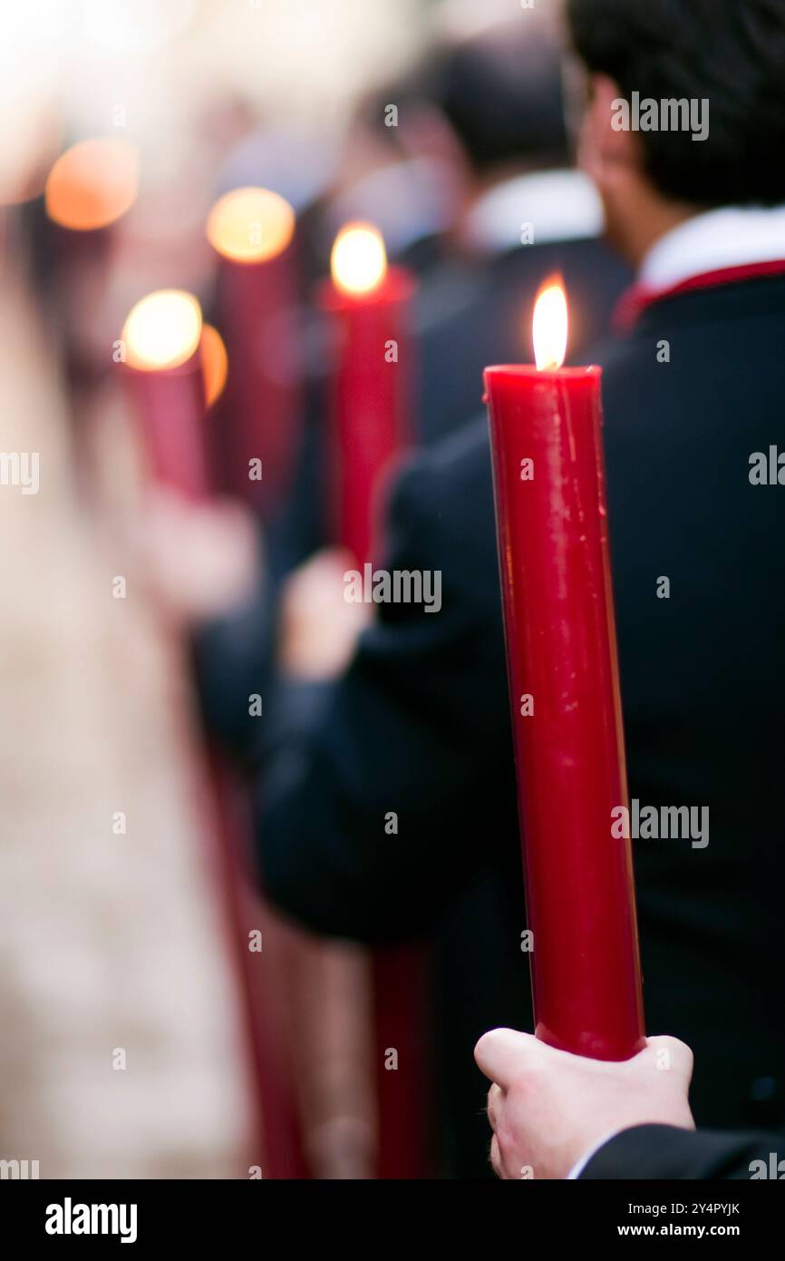 Brotherhood members march with candles in hand during the Corpus ...