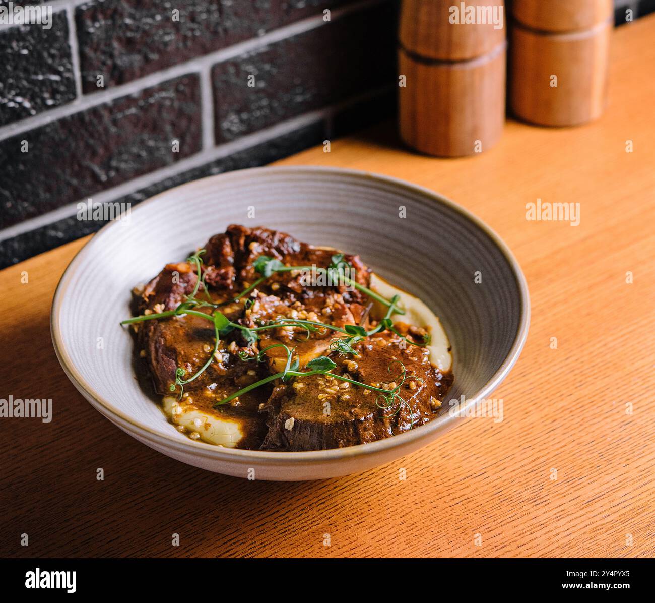 Traditional german braised veal cheeks in brown sauce with mashed ...