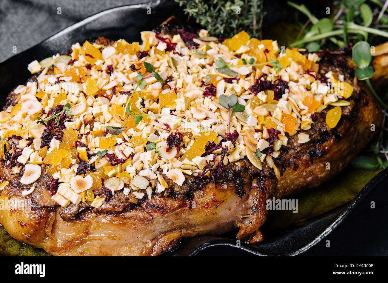 Barbecue tomahawk steak on black plate Stock Photo - Alamy