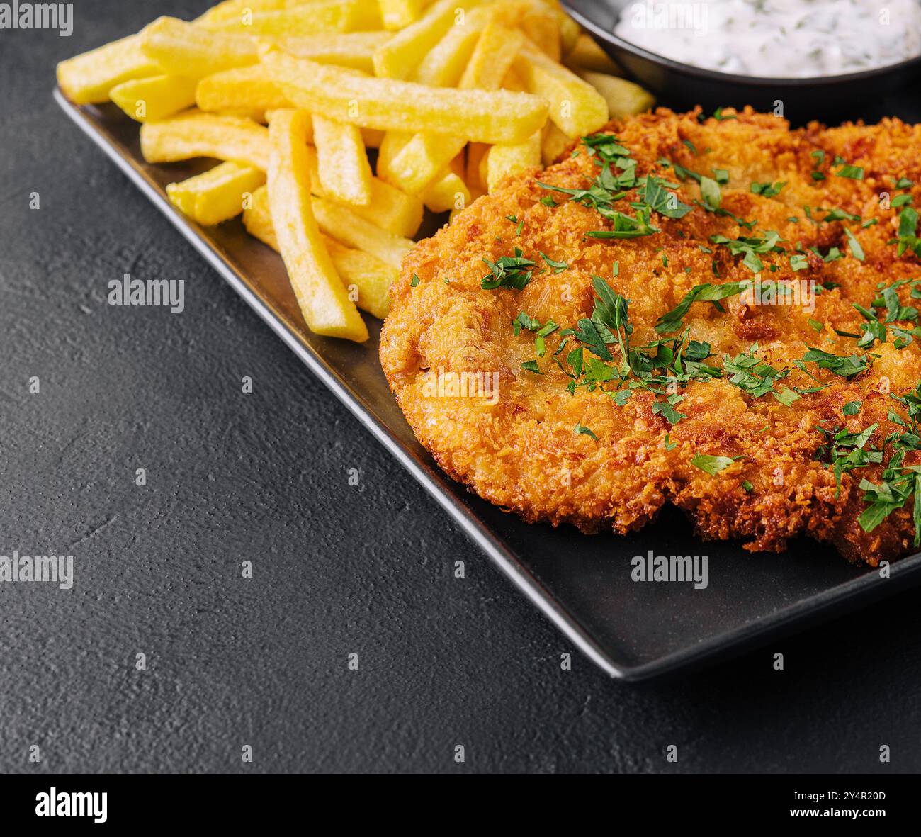 Fried wiener schnitzel from veal topside with french fries Stock Photo ...