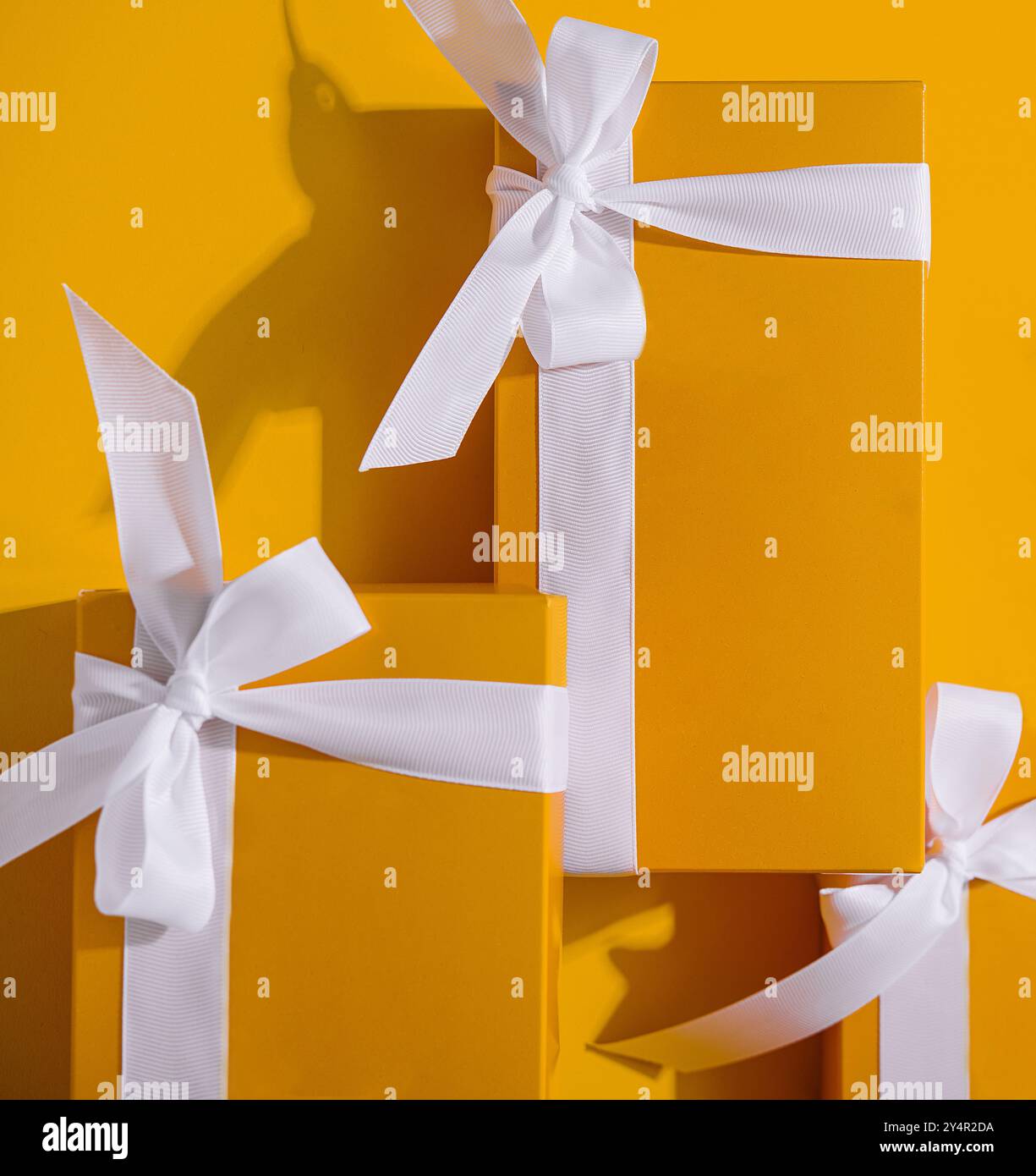 Yellow gifts on a yellow background Stock Photo - Alamy