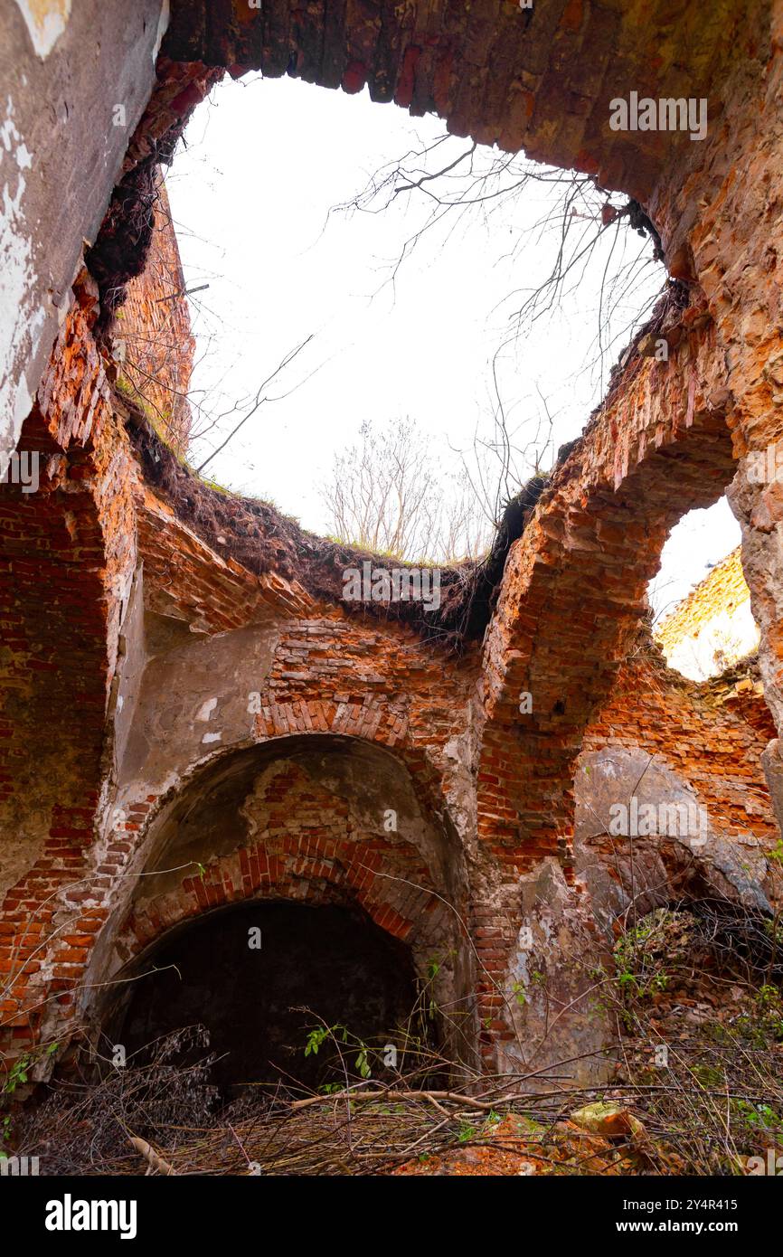 The old ruins of the collapsed walls with gates and windows ...