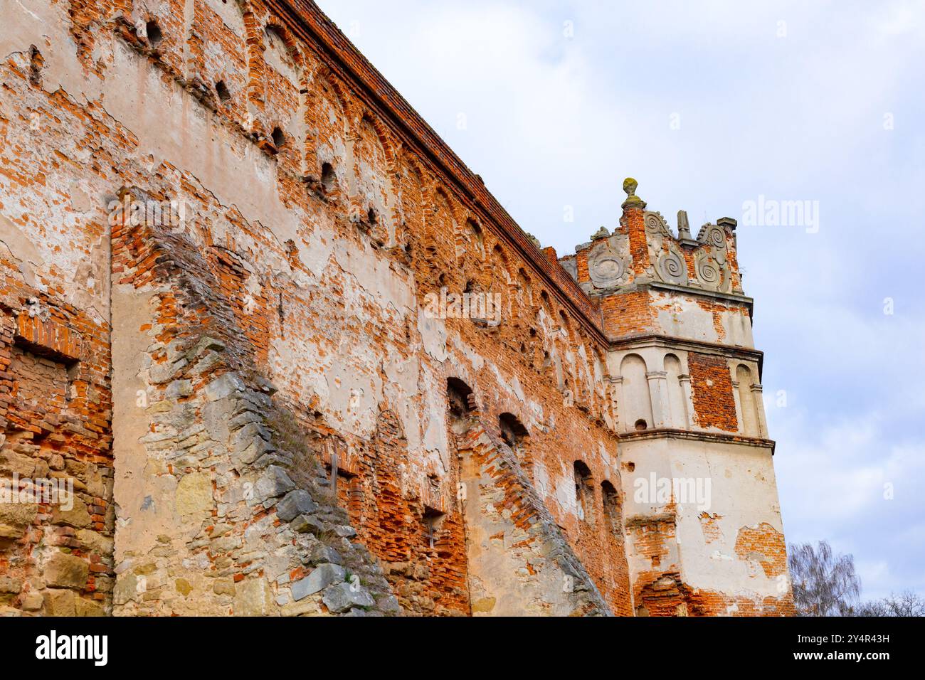The old ruins of the collapsed walls with gates and windows ...