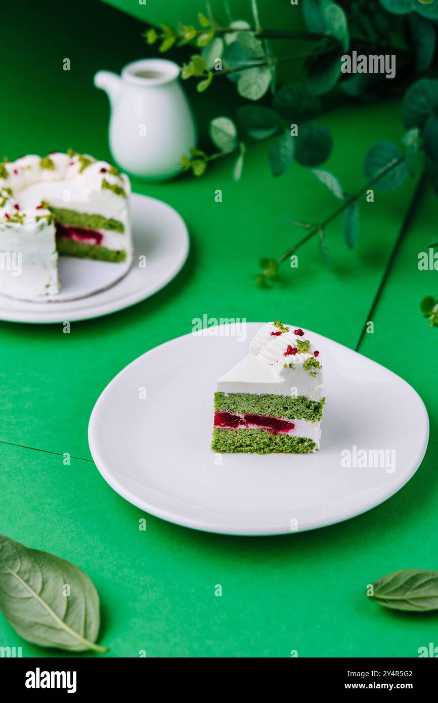 pistachio cake with raspberry jam inside Stock Photo - Alamy