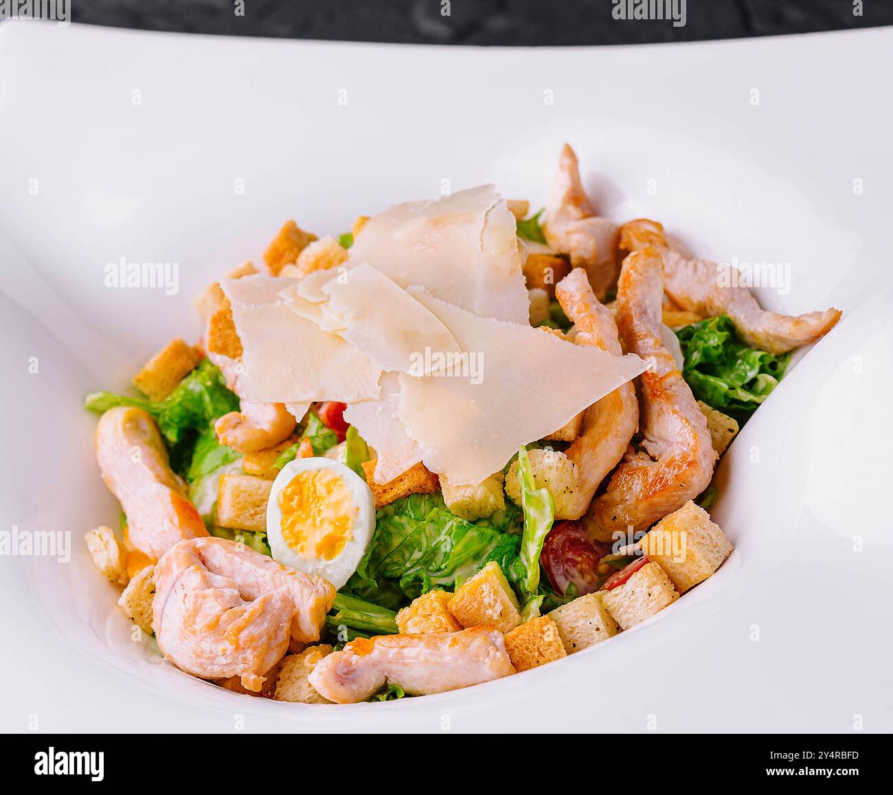 Caesar salad with grilled chicken meat, fresh lettuce, parmesan cheese ...