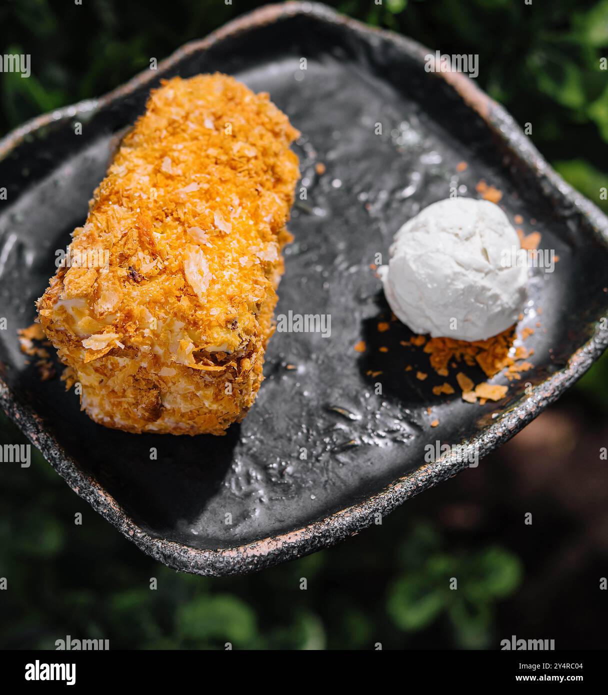 Puff pastry log cake with a scoop of ice cream Stock Photo - Alamy