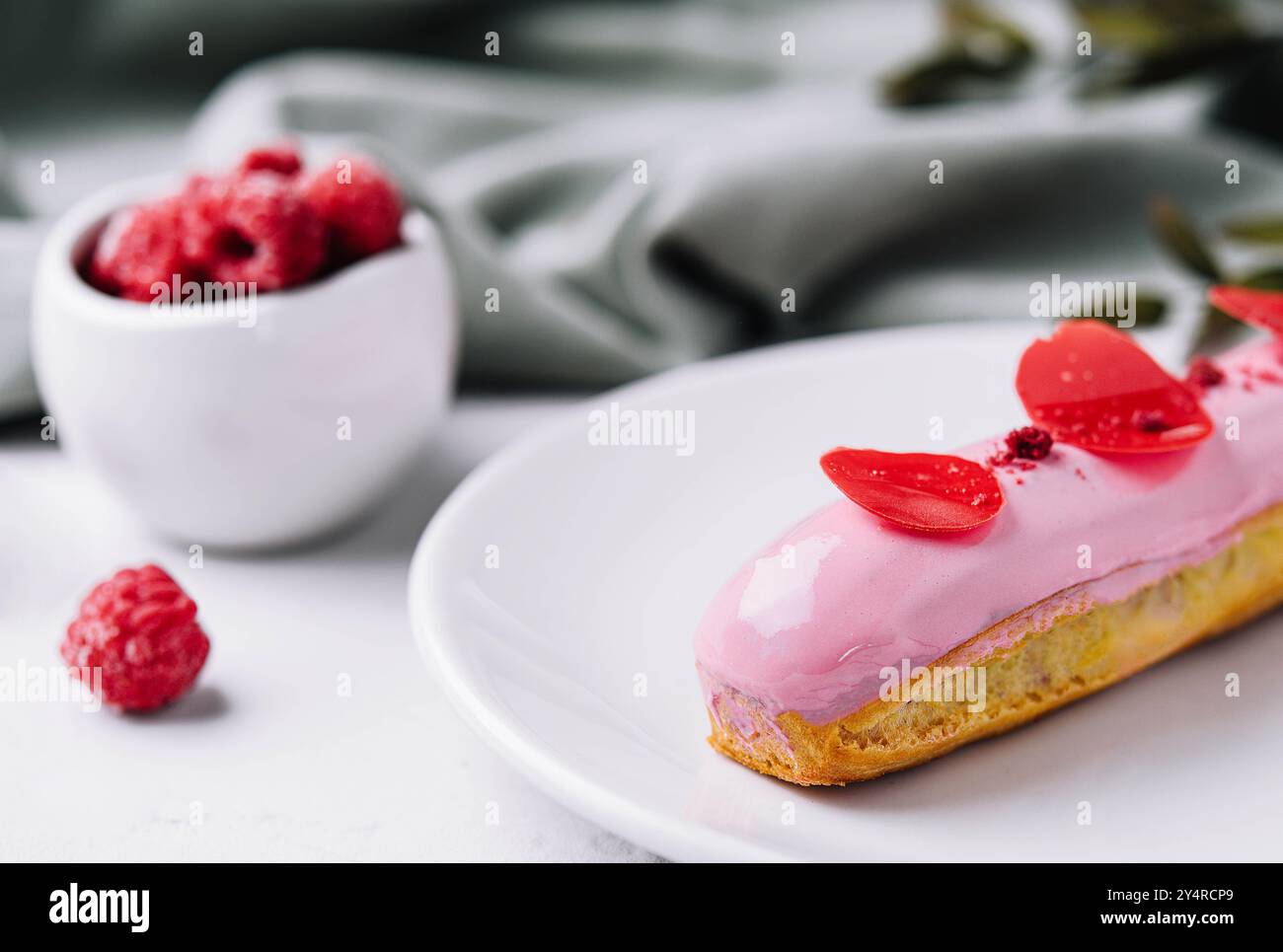 delicious eclairs with pink raspberry glaze Stock Photo - Alamy