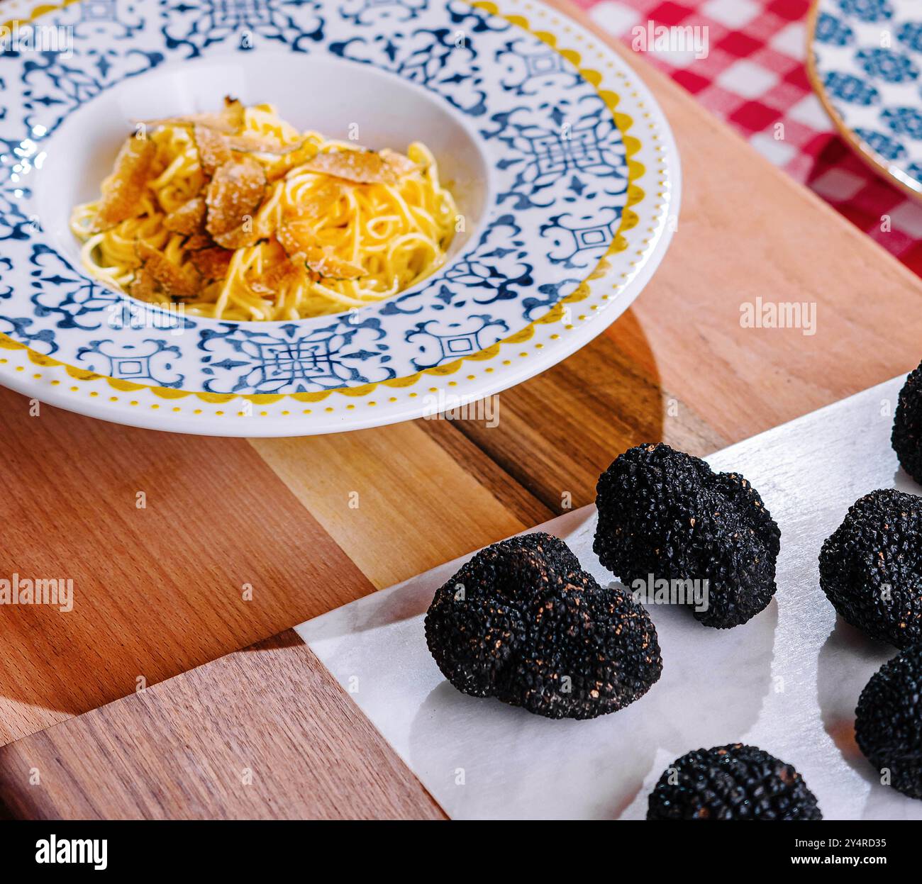 Chef Grating Truffle Shavings on Pasta with Parmesan Stock Photo - Alamy
