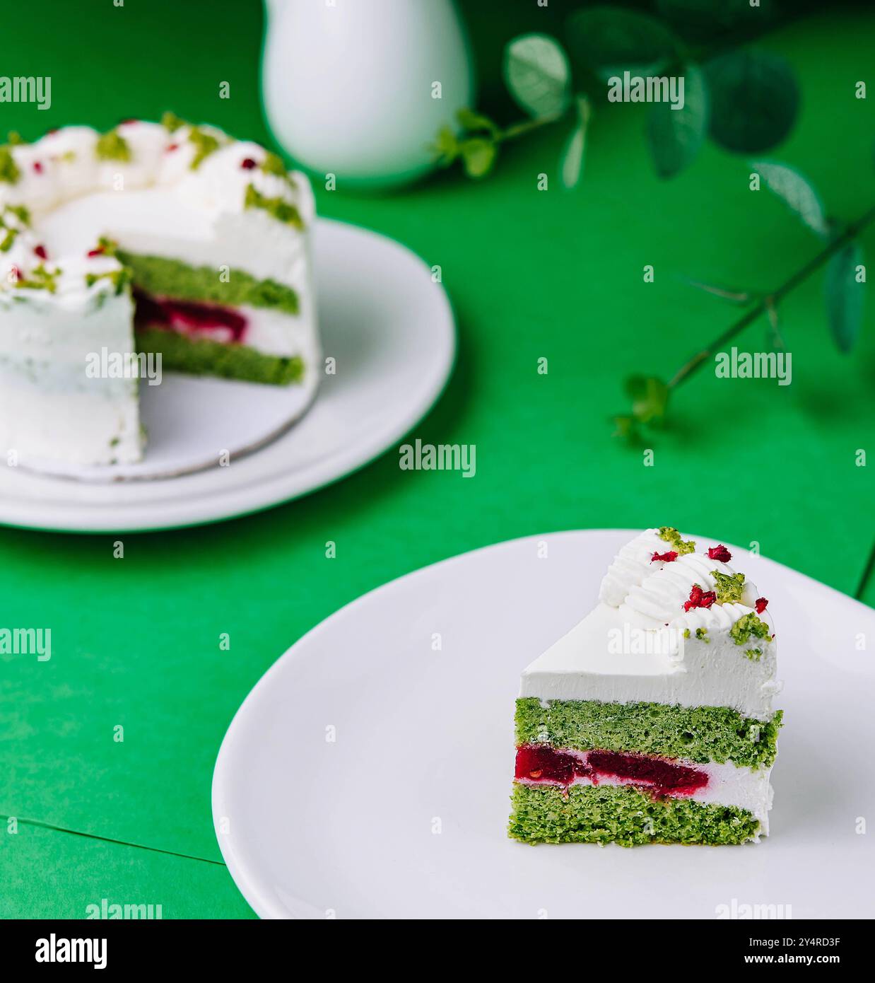 pistachio cake with raspberry jam inside Stock Photo - Alamy