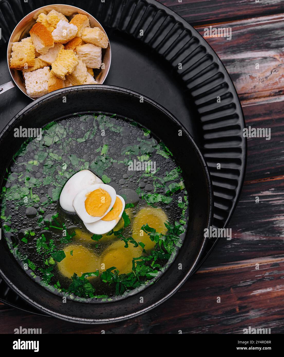 Homemade bouillon or broth with egg Stock Photo - Alamy