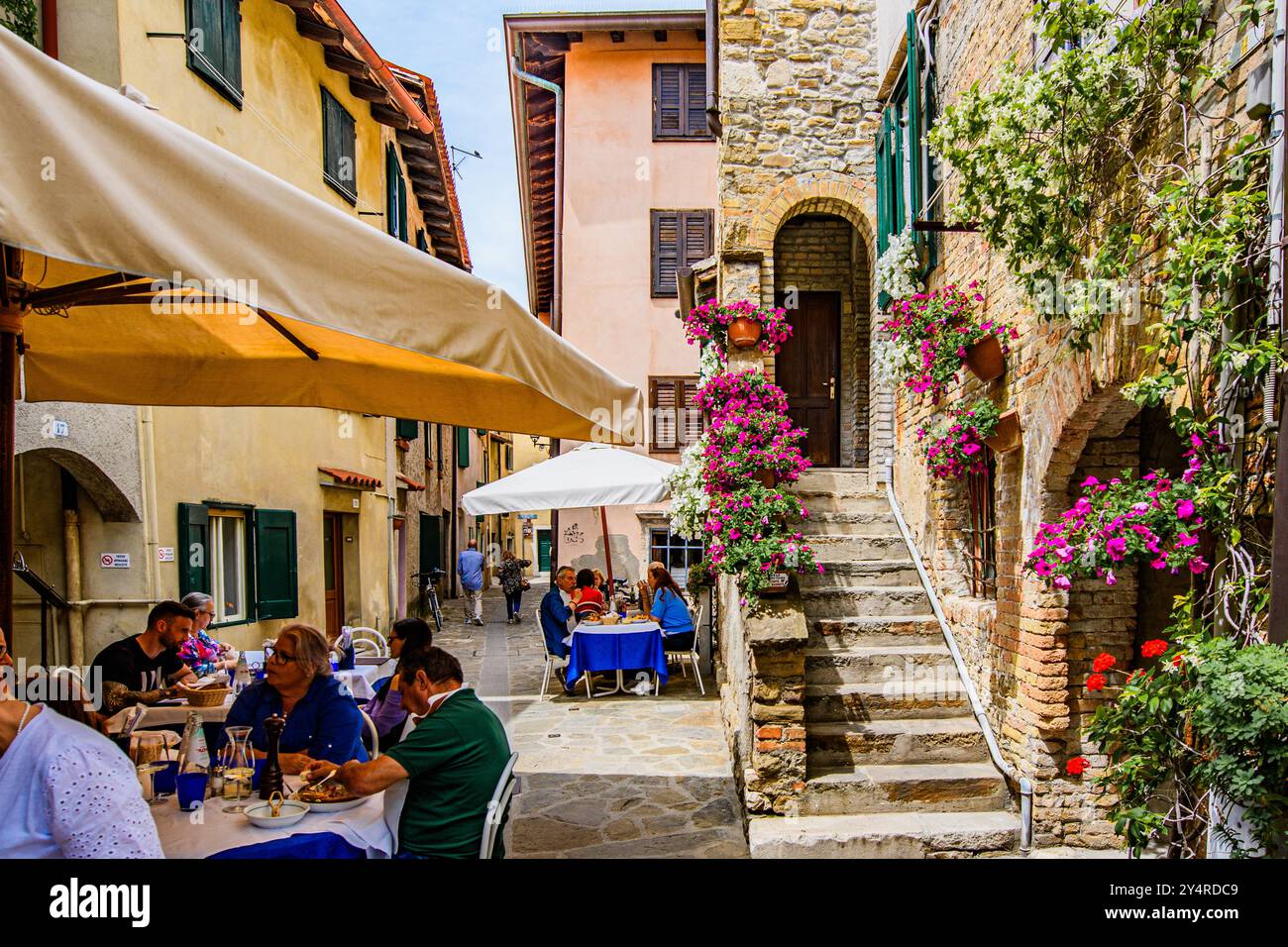 GRADO, ITALY – JUNE 2, 2024: Central street in Grado, a charming ...