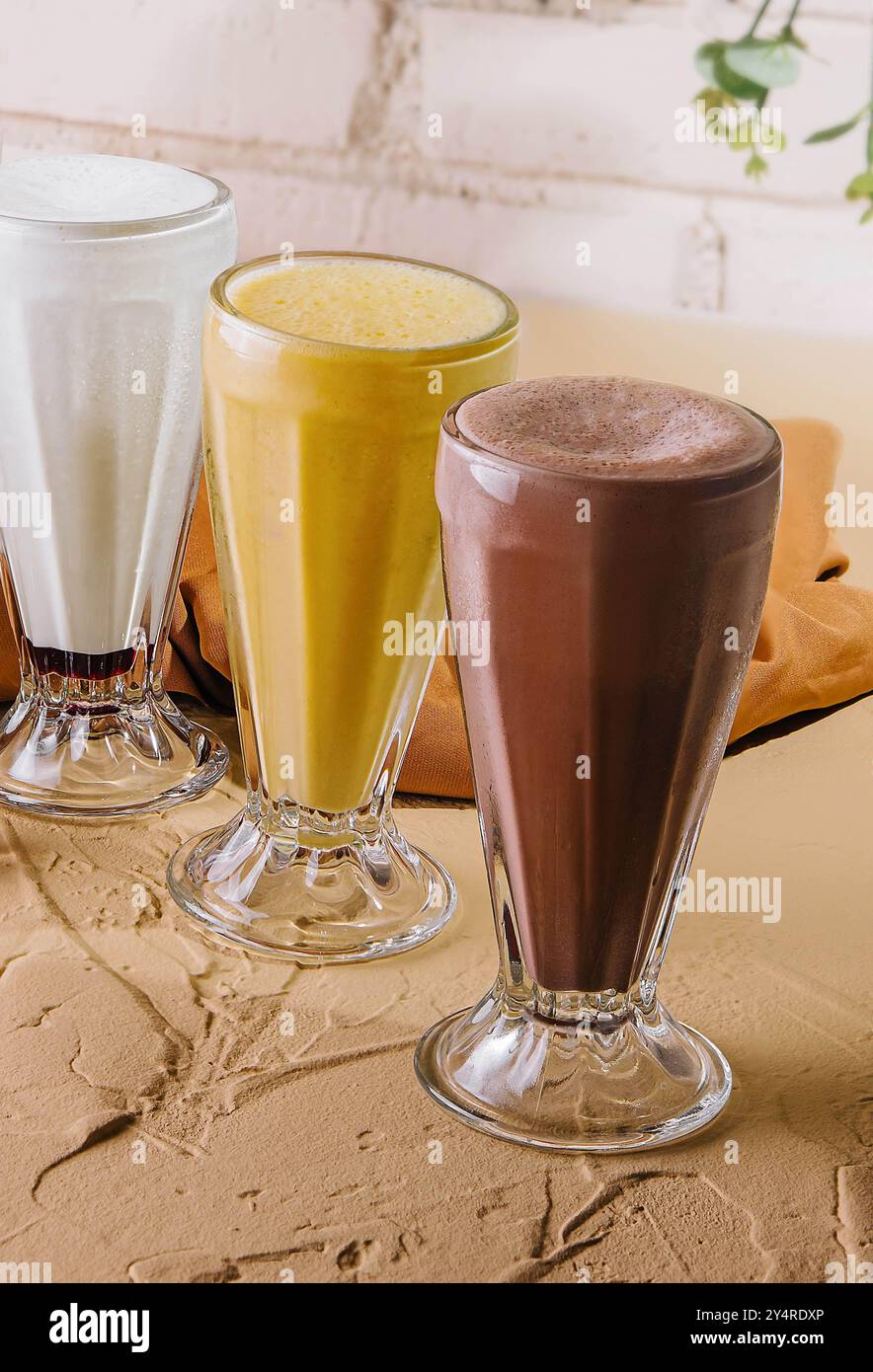 milkshake glasses featuring different flavors Stock Photo - Alamy