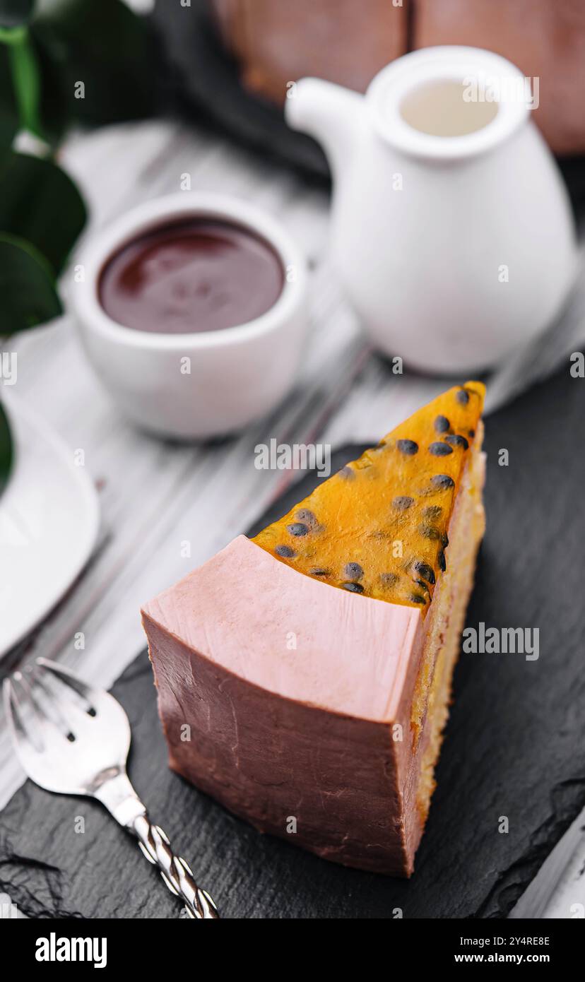 slice of chocolate cake with passion fruit Stock Photo - Alamy