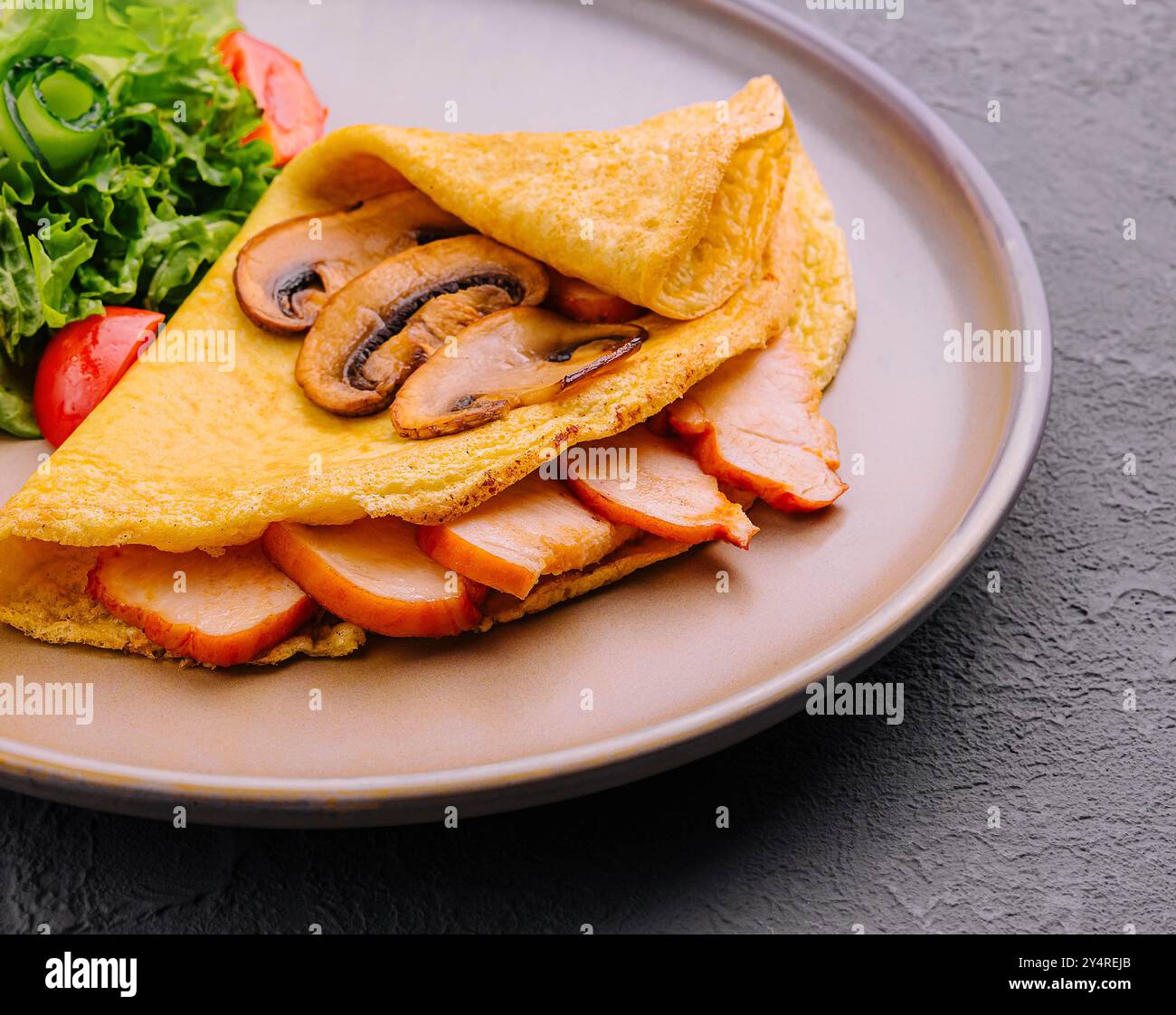 Thin delicious pancake with ham and mushrooms Stock Photo - Alamy