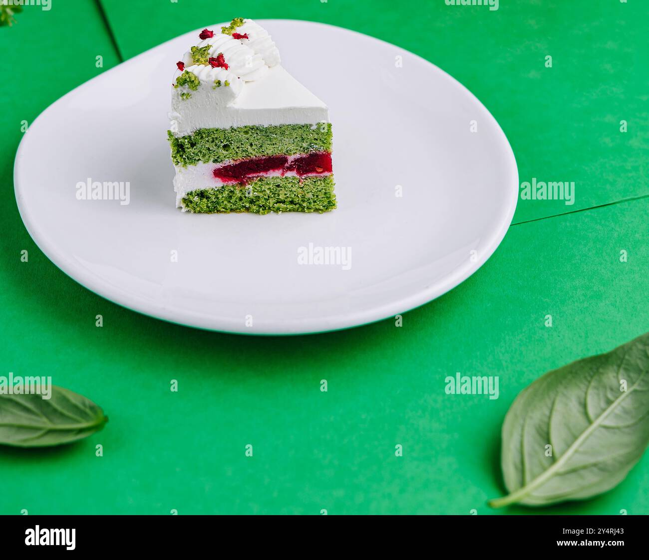 pistachio cake with raspberry jam inside Stock Photo - Alamy