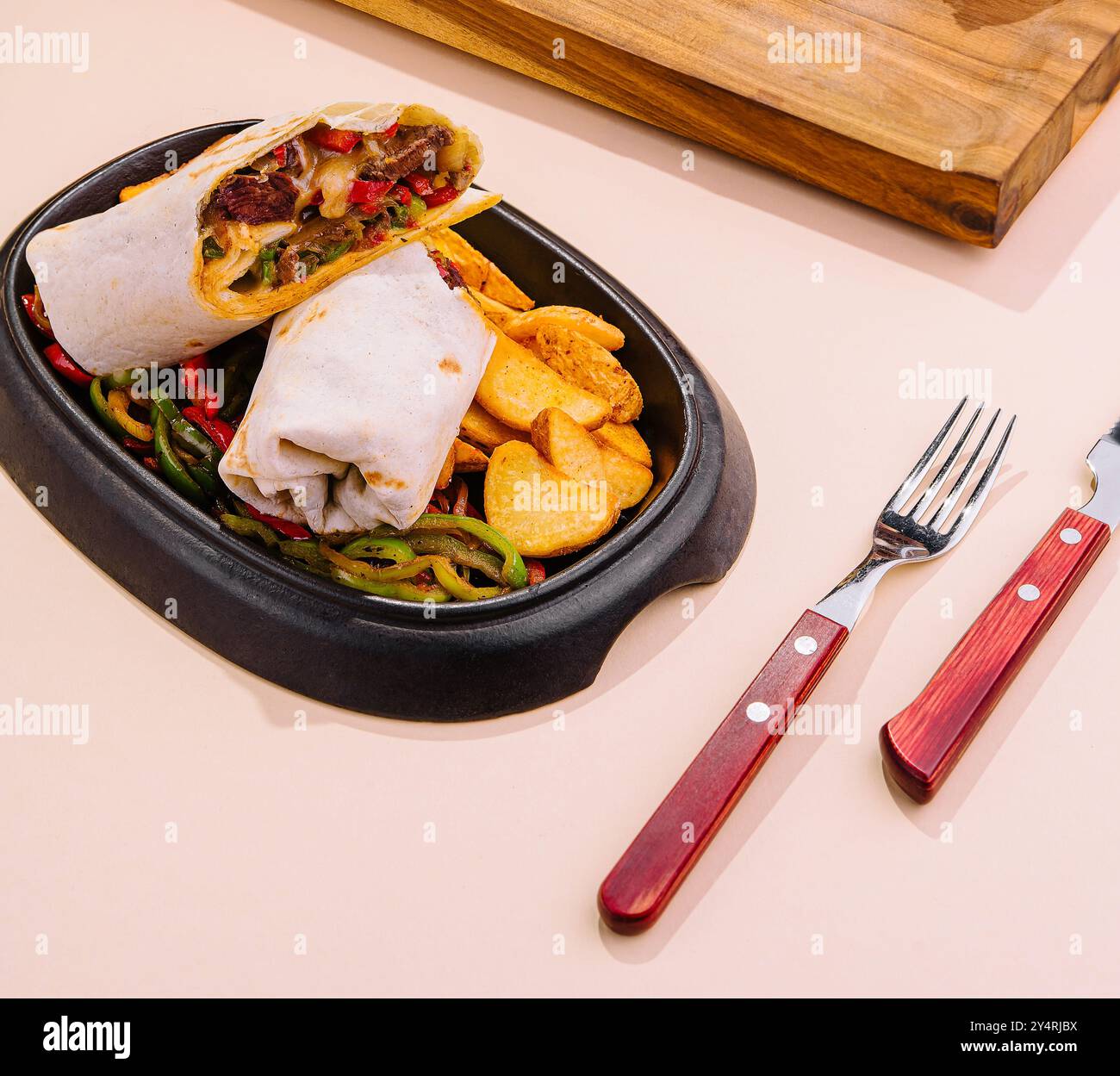 Doner kebab (shawarma) and potatoes slices Stock Photo - Alamy