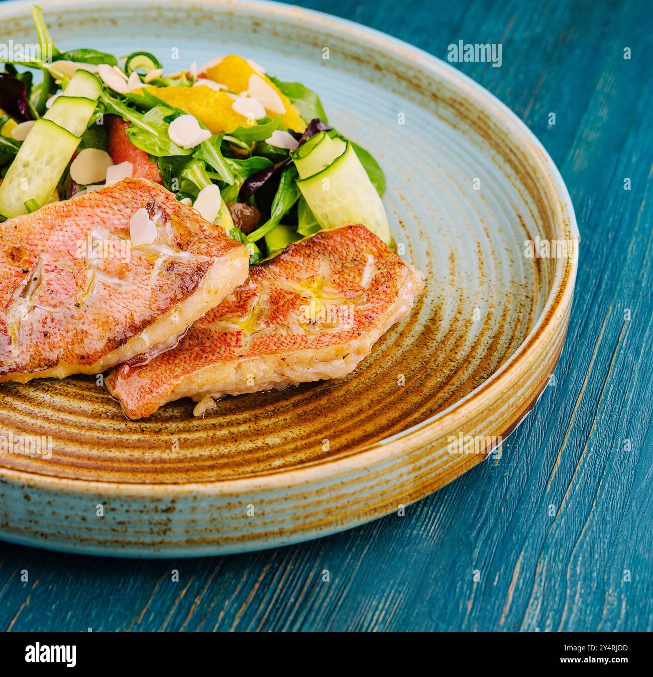 Grilled Red Snapper fish fillets and fresh vegetable salad Stock Photo ...